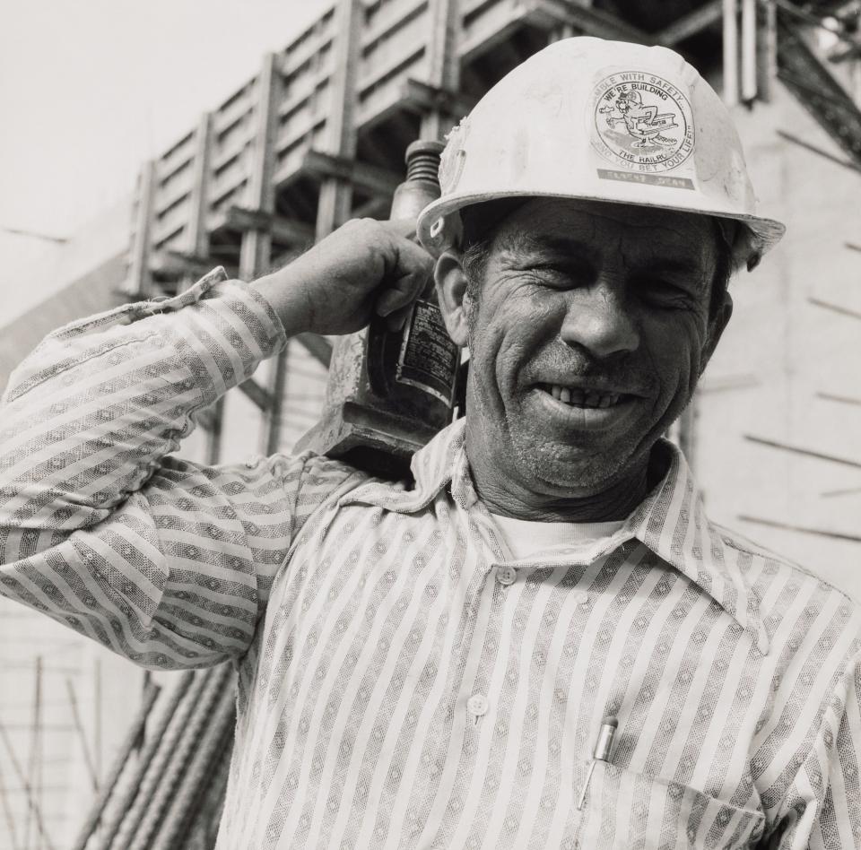 Workman with screw jack, Civic Center Station site | Smithsonian ...