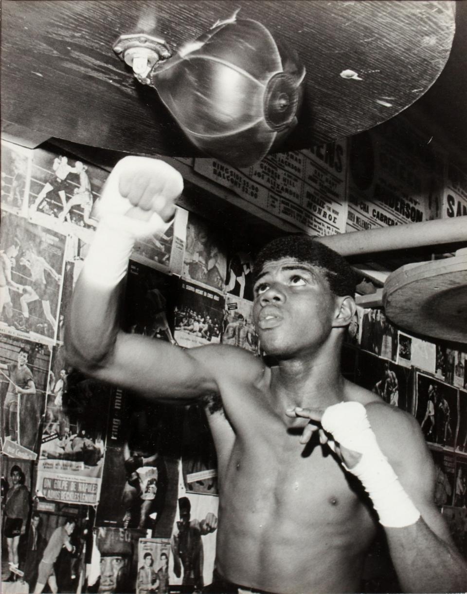Enrique Pinder with punching bag | Smithsonian American Art Museum