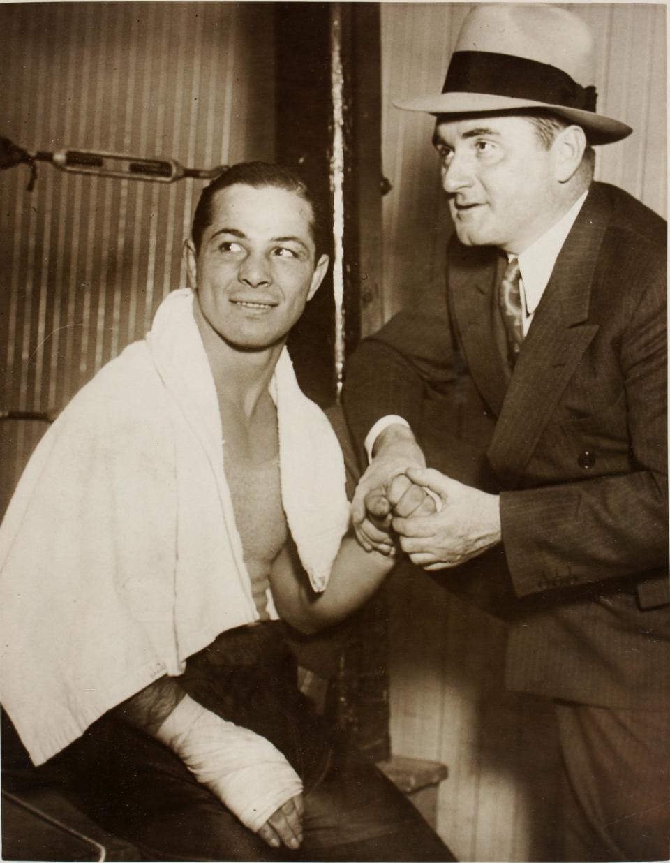 Unidentified boxer seated in ring with manager | Smithsonian American ...