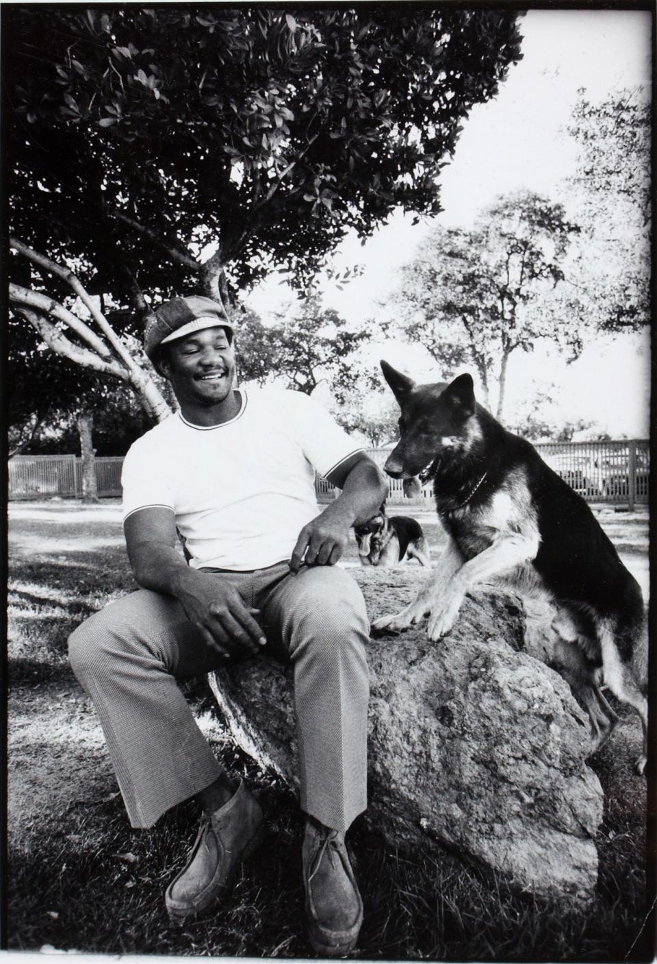 George Foreman with dog | Smithsonian American Art Museum