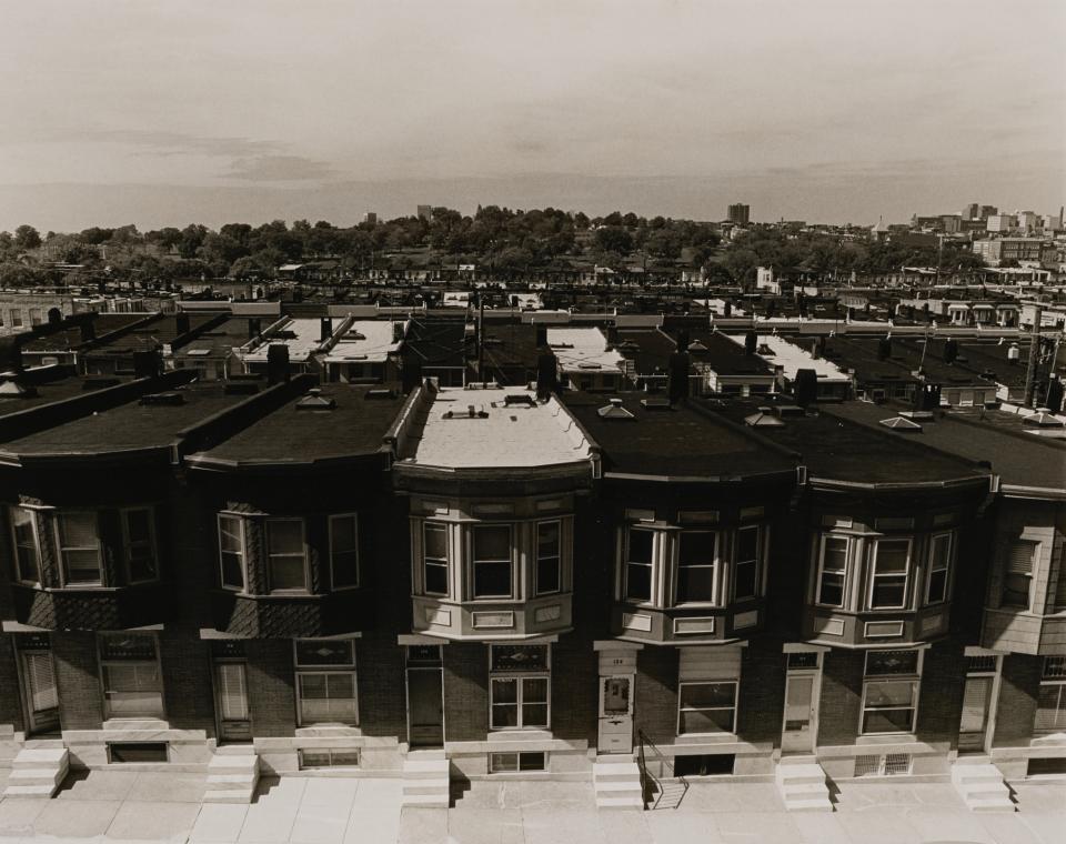 View of East Baltimore looking west. Brick row houses and white marble ...